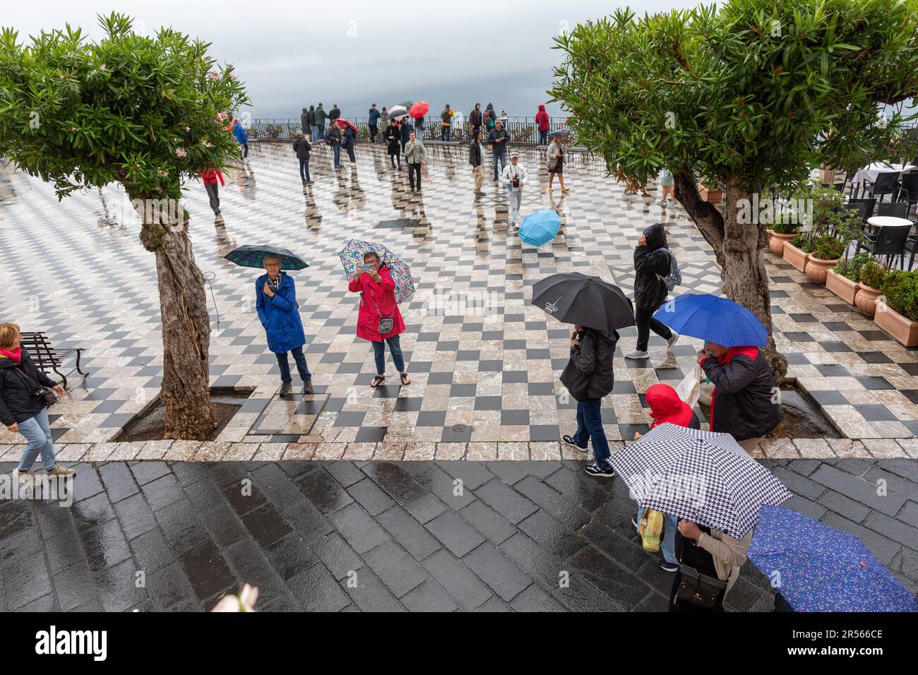 People using Umbrellas In Taormina Sicily Italy Stock Photo - Alamy