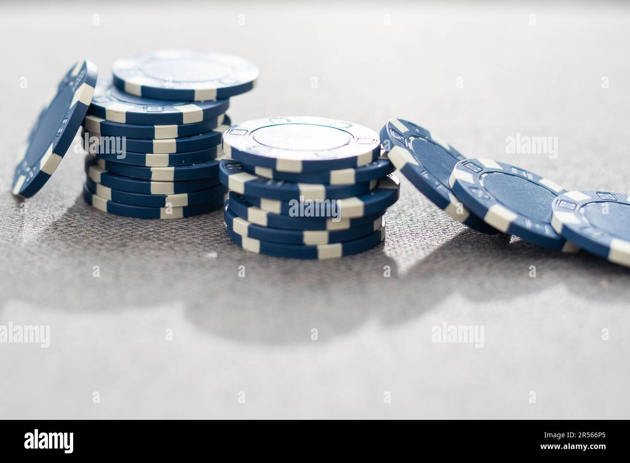 Small Stack of Blue Poker Chips, closeup on background Stock Photo - Alamy