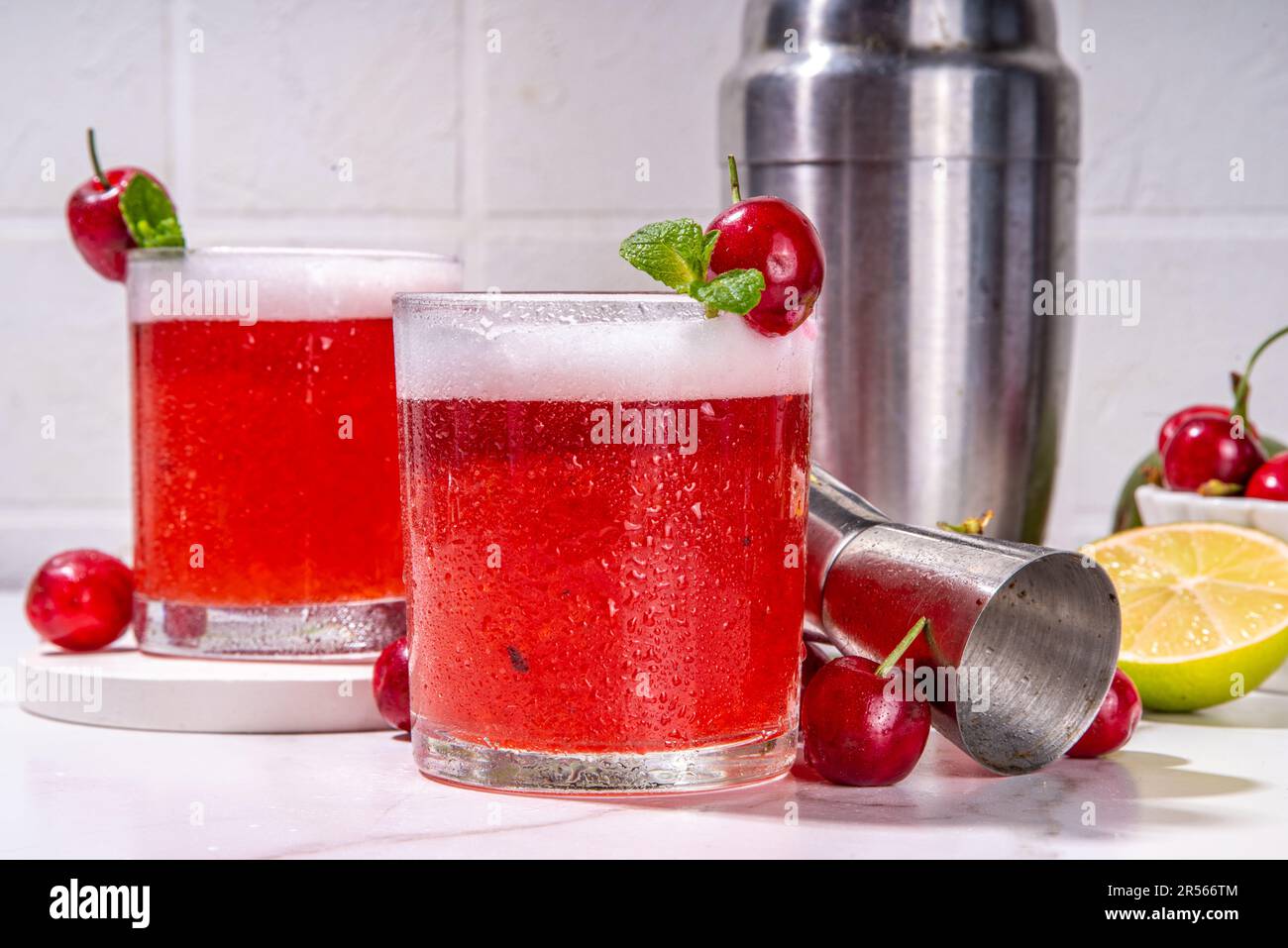 Cherry and lime alcoholic booze cocktail, sweet summer alcohol drink ...