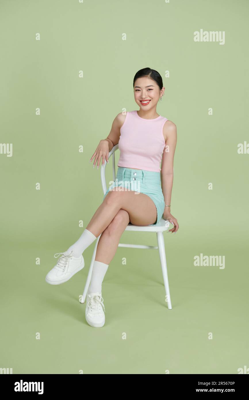 Full length photo of cheerful young pretty woman sit chair good mood ...