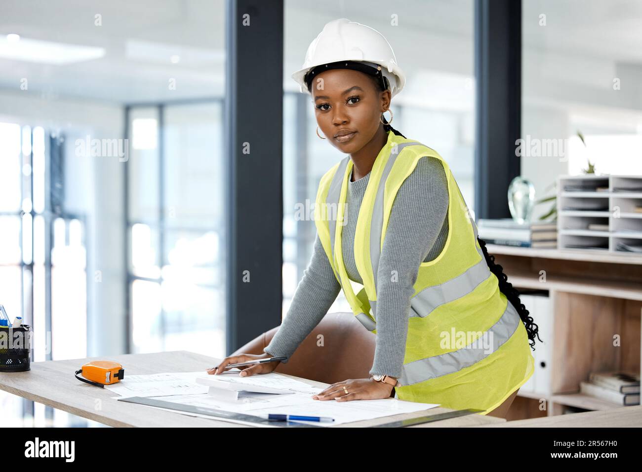 Architecture, planning and blueprint with portrait of black woman in ...