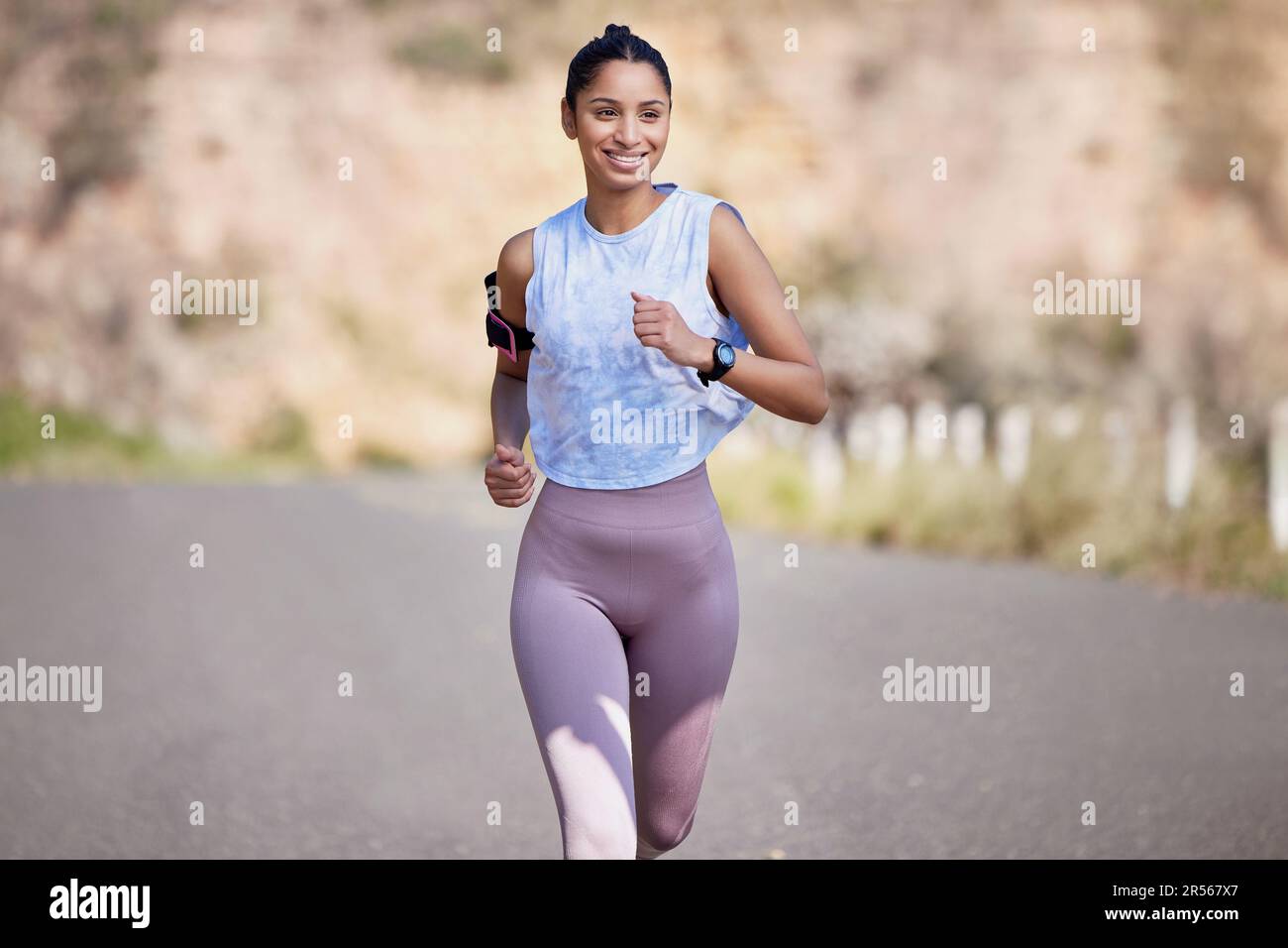 Road, running and woman with fitness, exercise and workout goal with ...