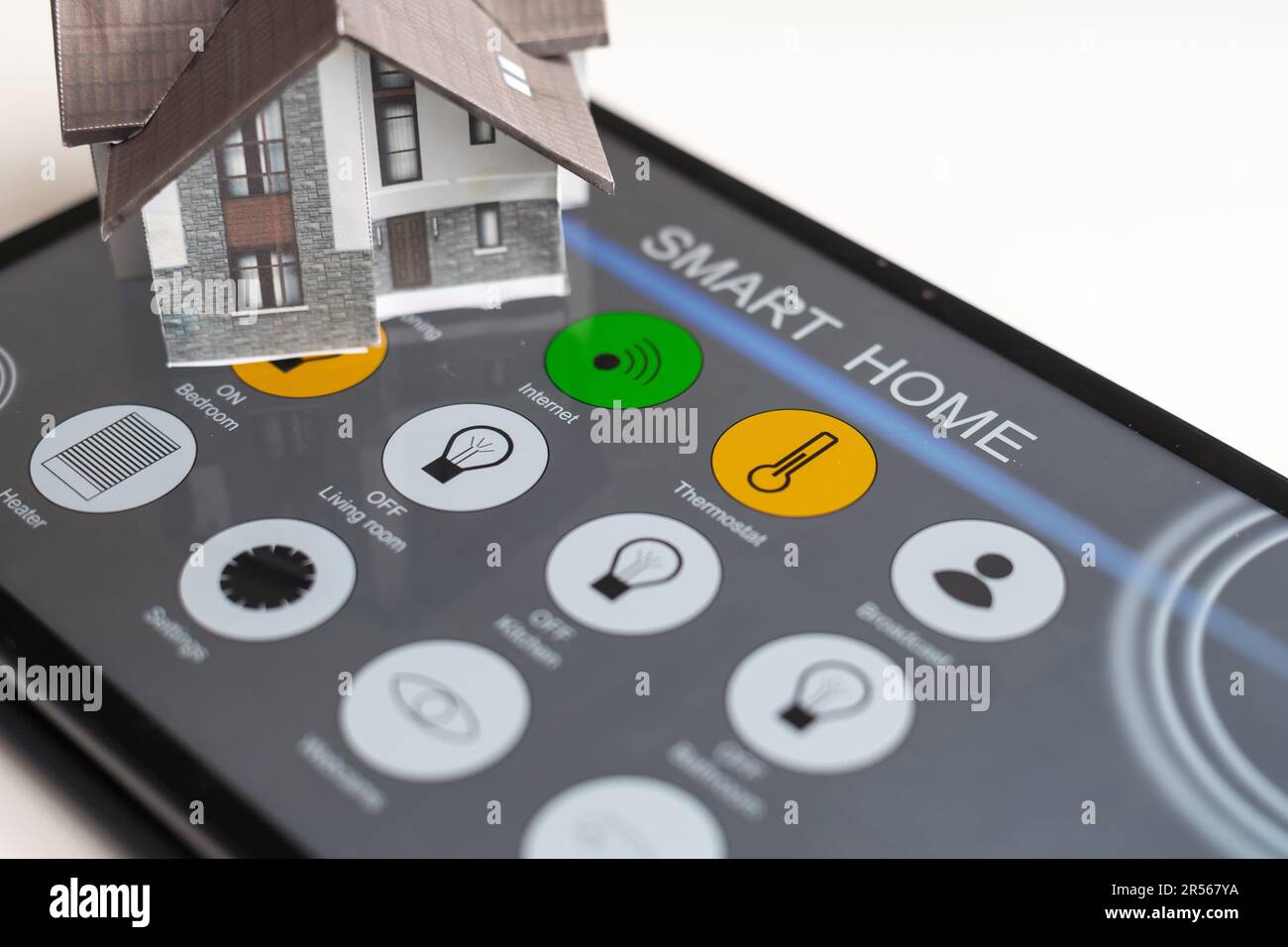 Small house model is on table and icons home electronics devices ...