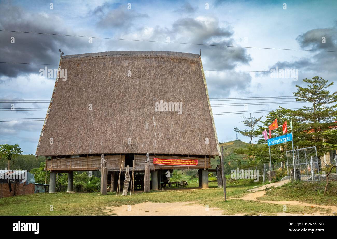 A traditional "nha rong", or cultural house, with its soaring sail-like ...