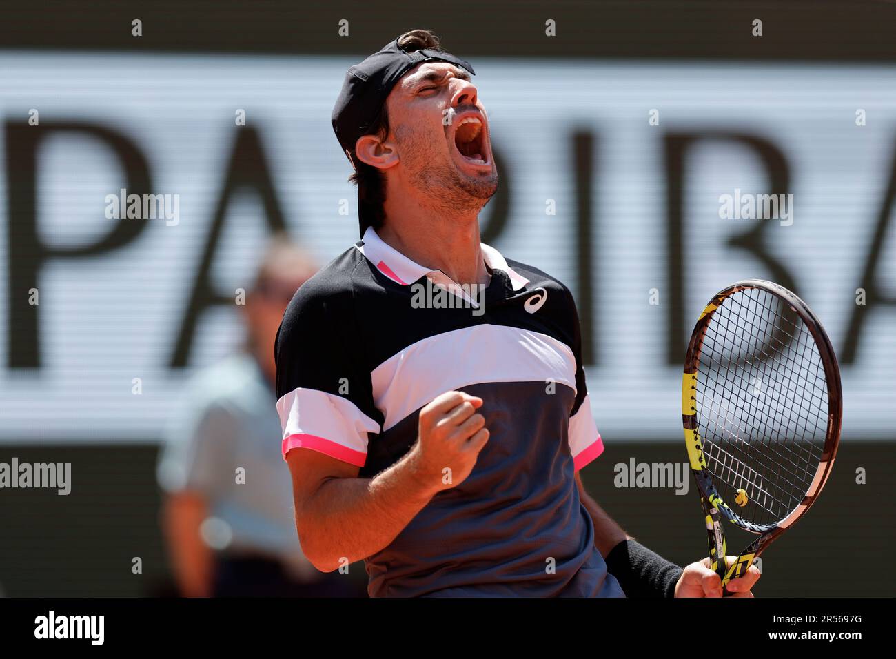 Italy's Giulio Zeppieri clenches his fist after scoring a point against ...