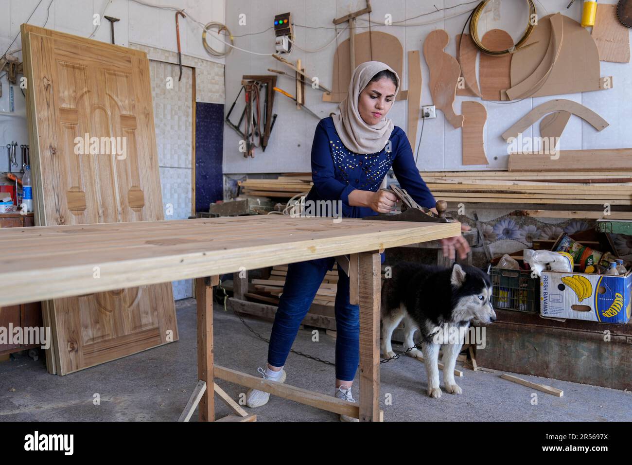 Iraqi carpenter Aliyaa Tami, 30, works at her workshop in Baghdad, Iraq, Thursday, Jun.1, 2023 ...
