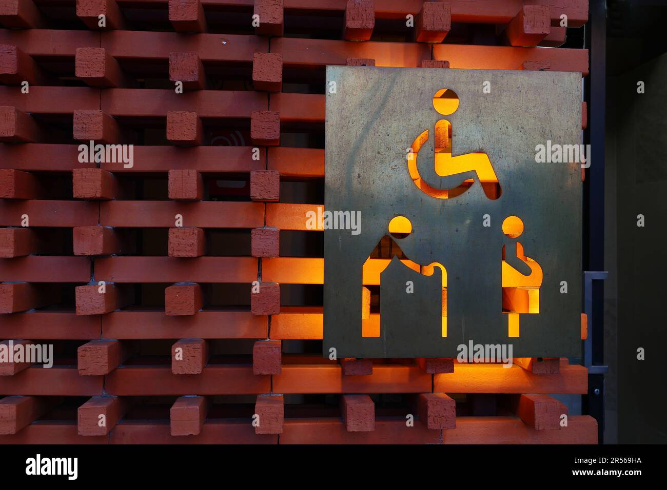 Toilets Sign with lighting in nature background Stock Photo - Alamy