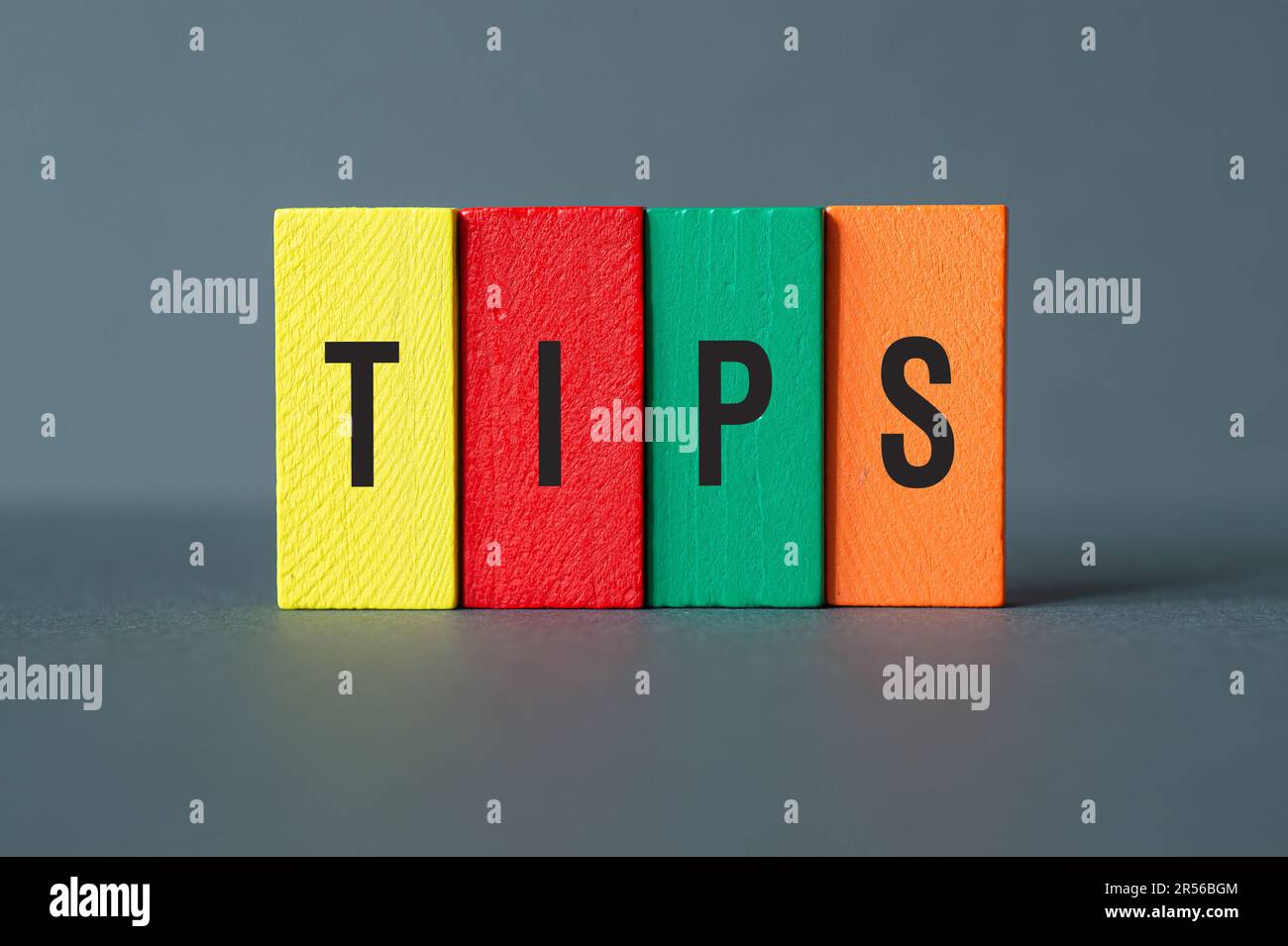 Tips - word concept on building blocks, text Stock Photo - Alamy