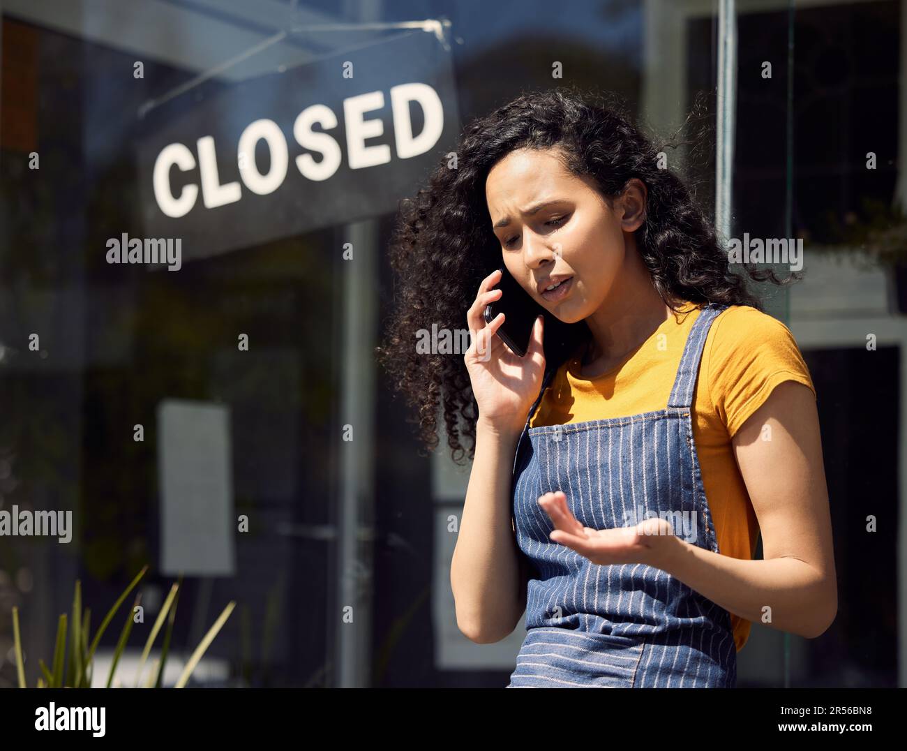 Woman, closed business and sign in window with phone call, stress and ...