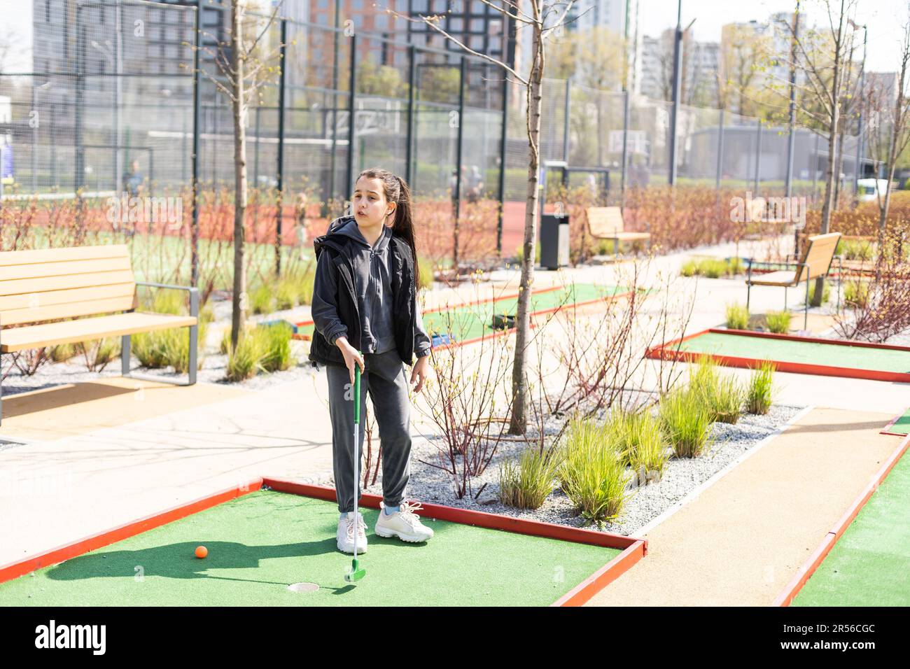cute little girl on a miniature golf course Stock Photo - Alamy