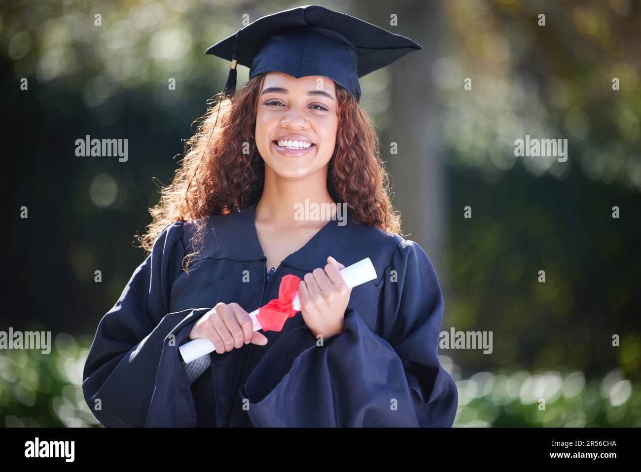Graduation, smile and portrait of woman at college with diploma ...