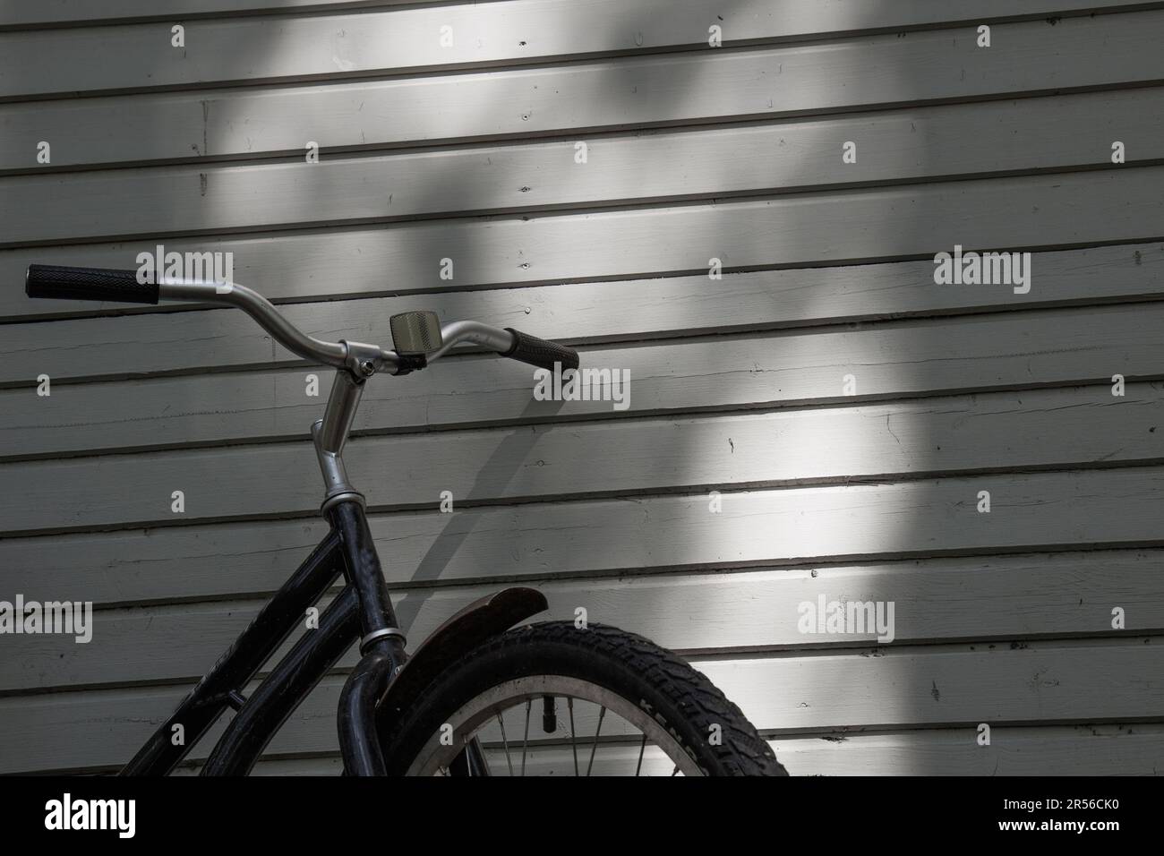 bike and shadow on old wood texture, front and background blurred with ...