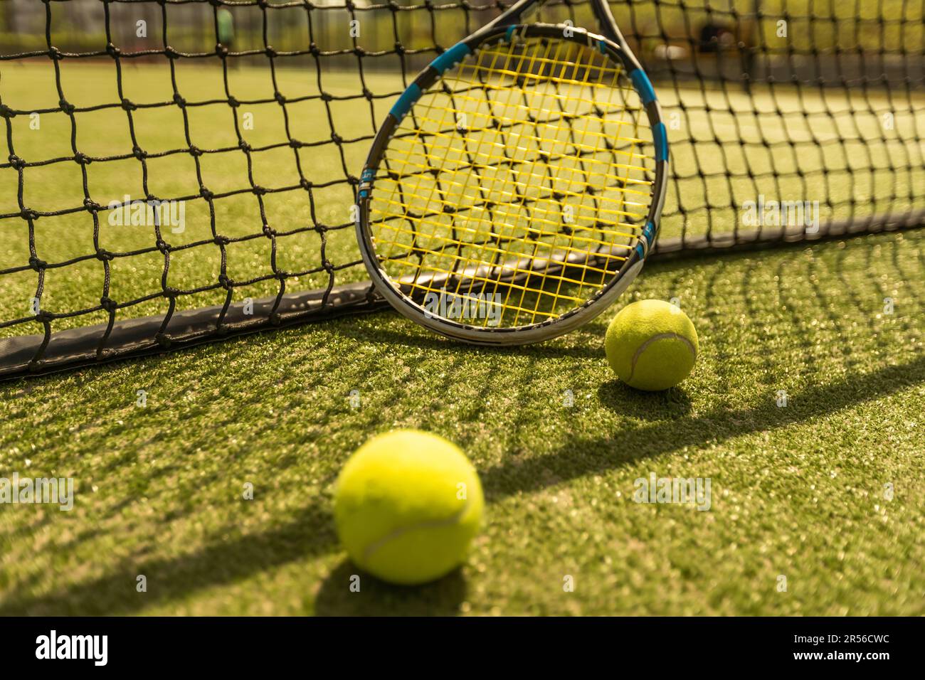 tennis racket with a tennis ball on a tennis court Stock Photo - Alamy