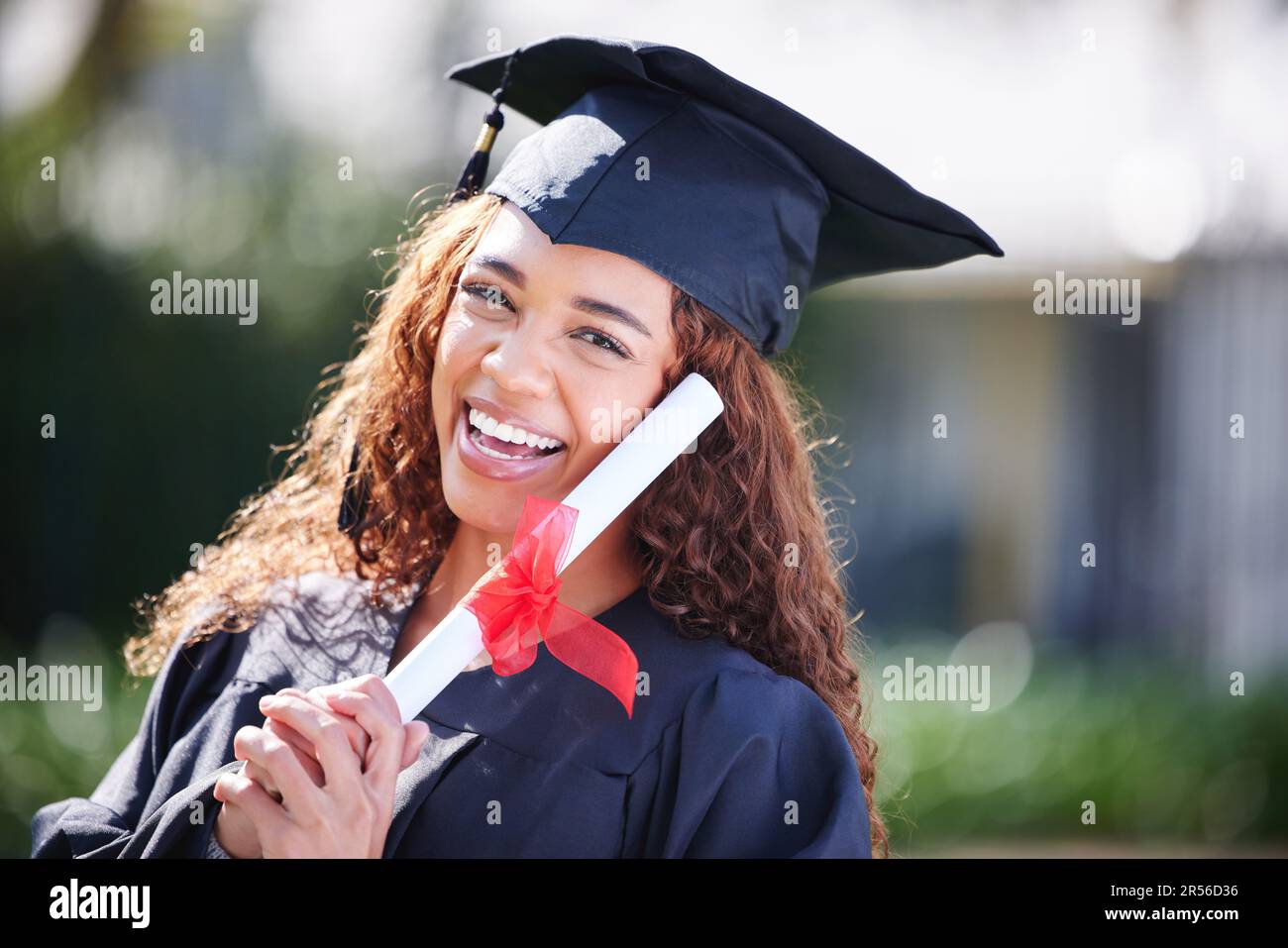 Graduation, diploma and portrait of woman at college with certificate ...