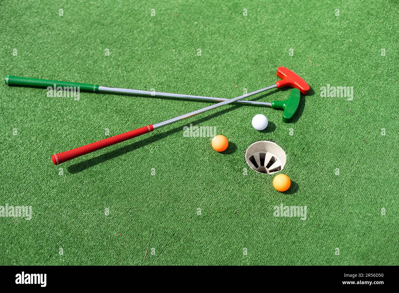 Mini-golf ball on artificial grass. Summer season game Stock Photo - Alamy
