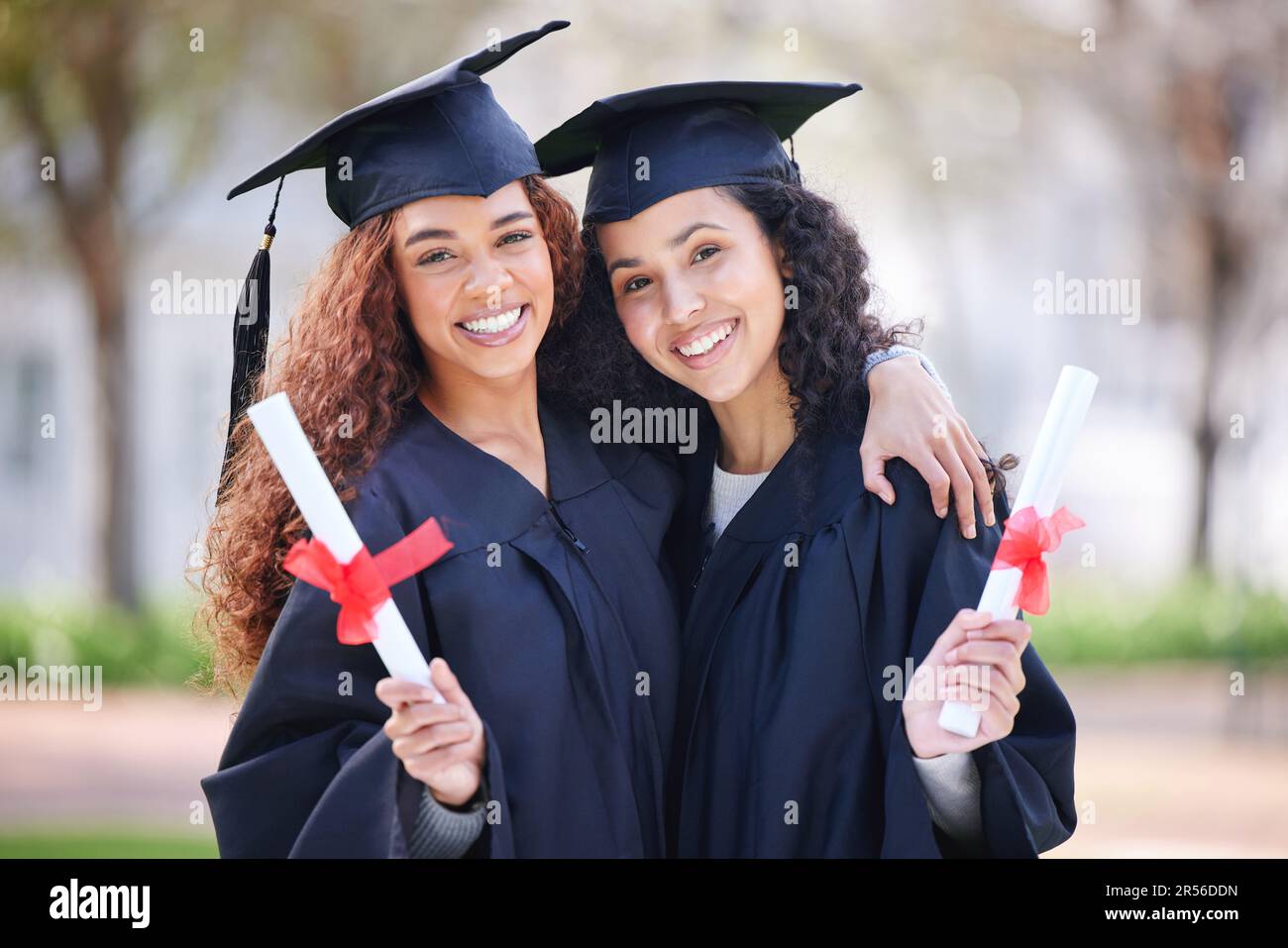 Women friends, portrait and graduation certificate with smile ...