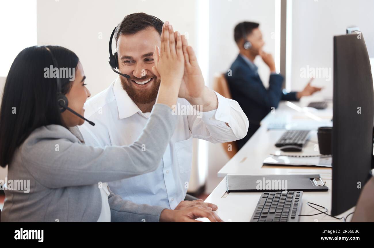 Call center, teamwork and high five for working, telemarketing and ...
