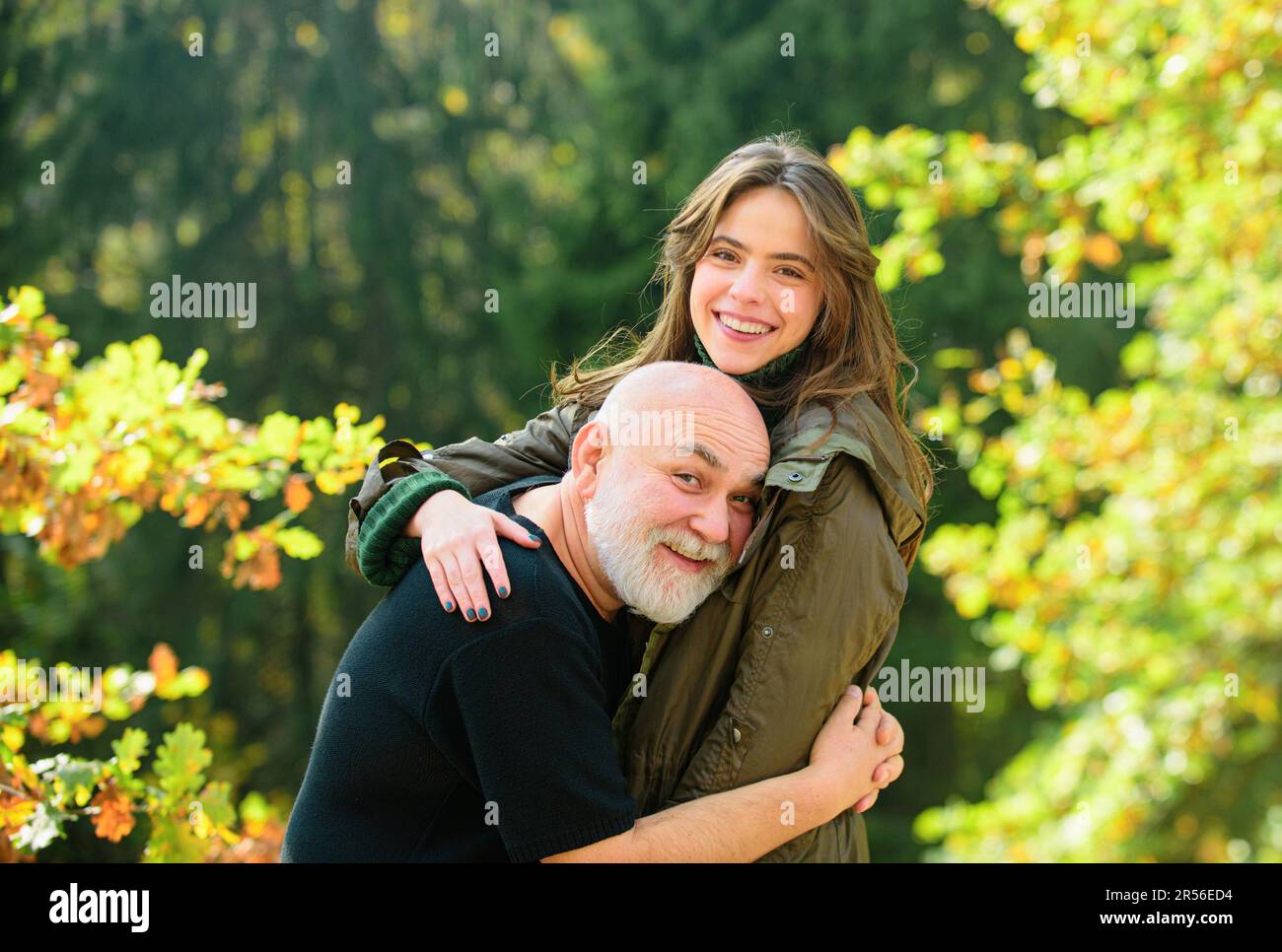 Happy elderly father and daughter enjoying tender autumn moment ...