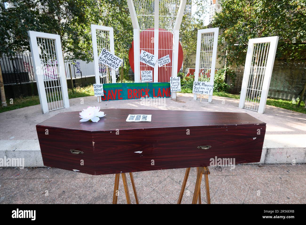 A coffin sits in Altab Ali Park before a funeral procession against ...