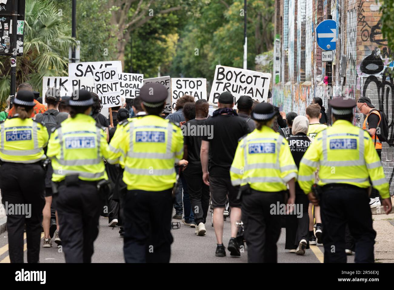 Police follow a protest march from Altab Ali Park to the Truman Brewery ...