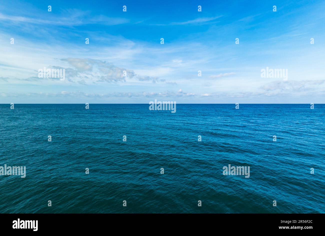 Aerial view of a blue sea surface water texture background,Amazing sun reflections Aerial flying ...