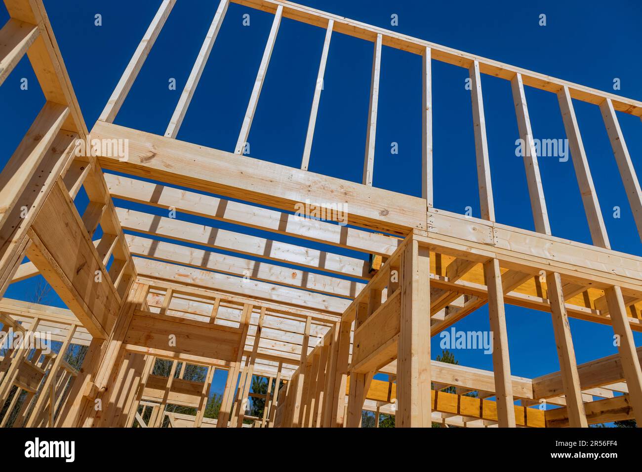 New build house with wood beam stick framework is constructed in frame ...