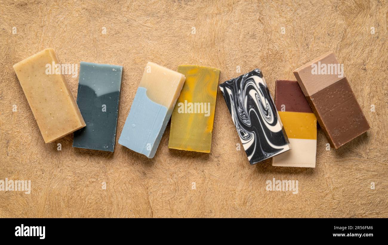 variety of 7 organic, artisan soap bars on a textured bark paper Stock ...