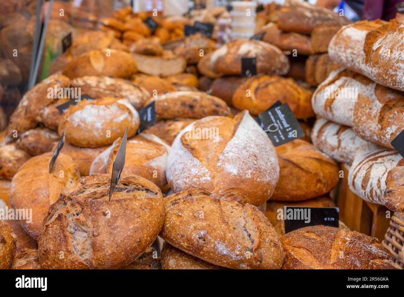 Netherlands. Farmers market in Amsterdam. Many loaves of fresh bread ...
