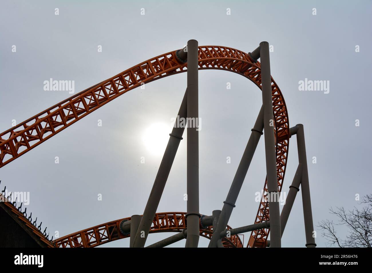 Part of a roller coaster with sky and sun Stock Photo - Alamy