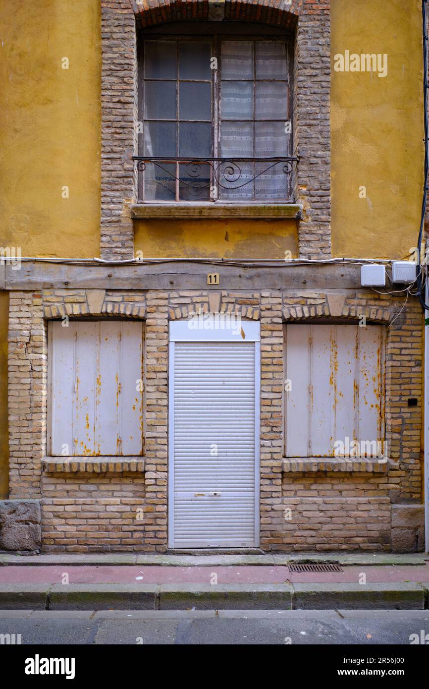 Dieppe, Normandy, France - September 23 2022:An old brick faced buiklding with closed shutters ...