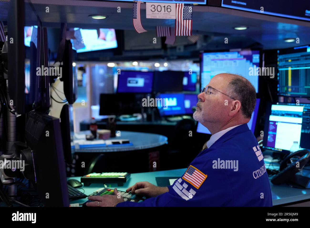 Traders work on the floor at the New York Stock Exchange in New York ...