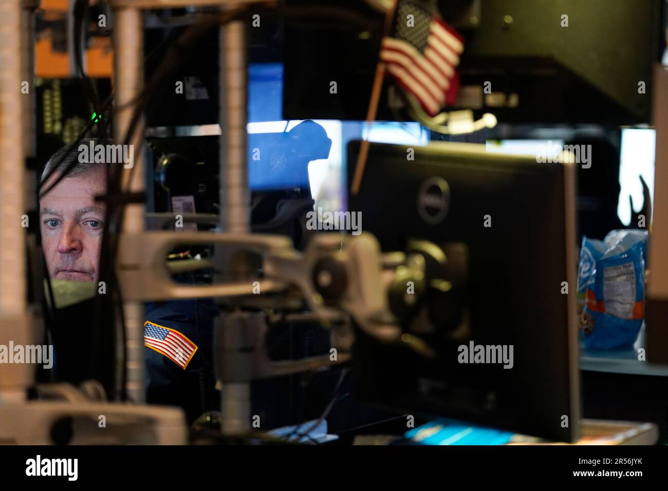 Traders work on the floor at the New York Stock Exchange in New York ...