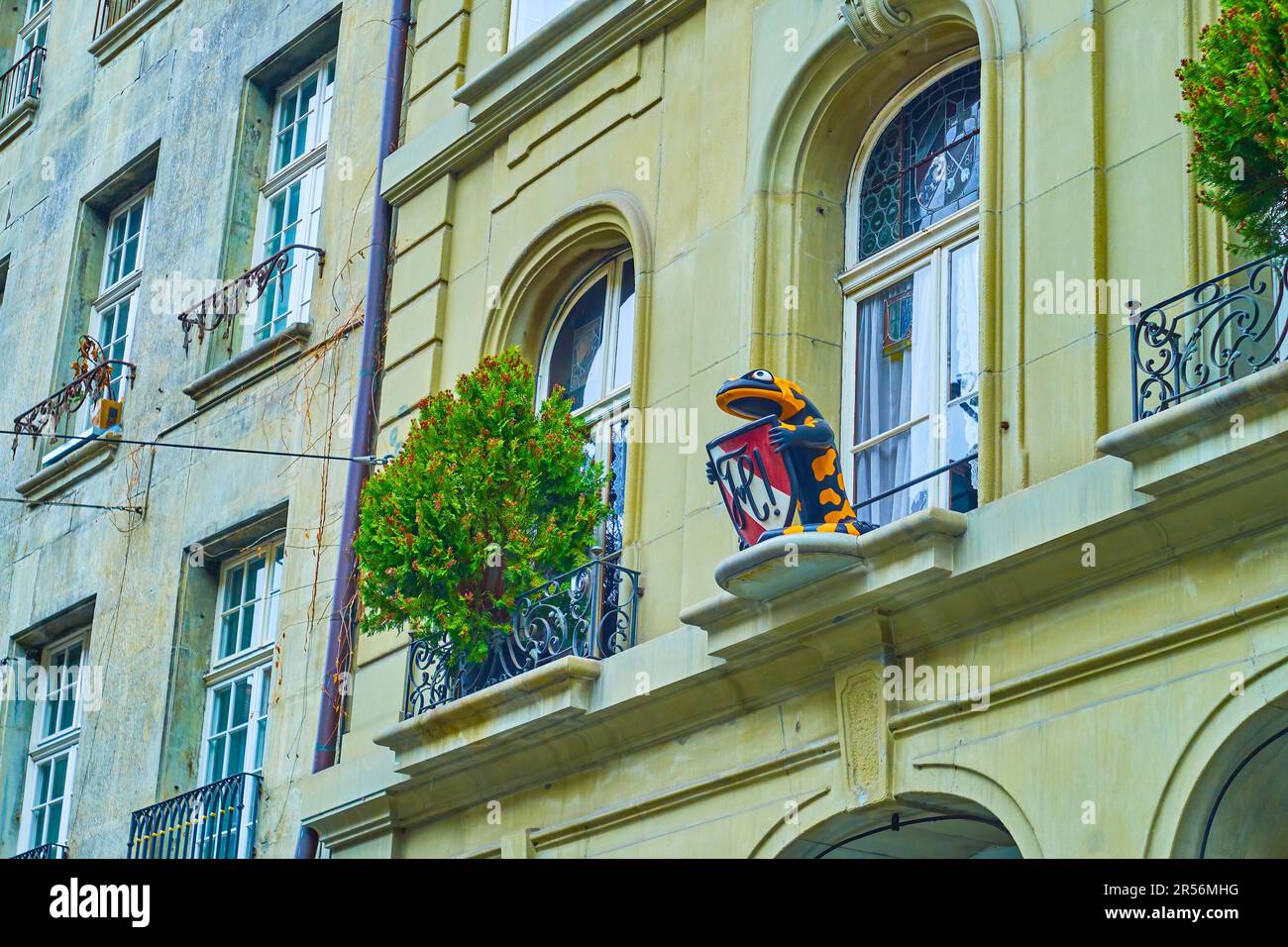 The colorful sculpture of Lizard, holding the shield with coat of arms ...