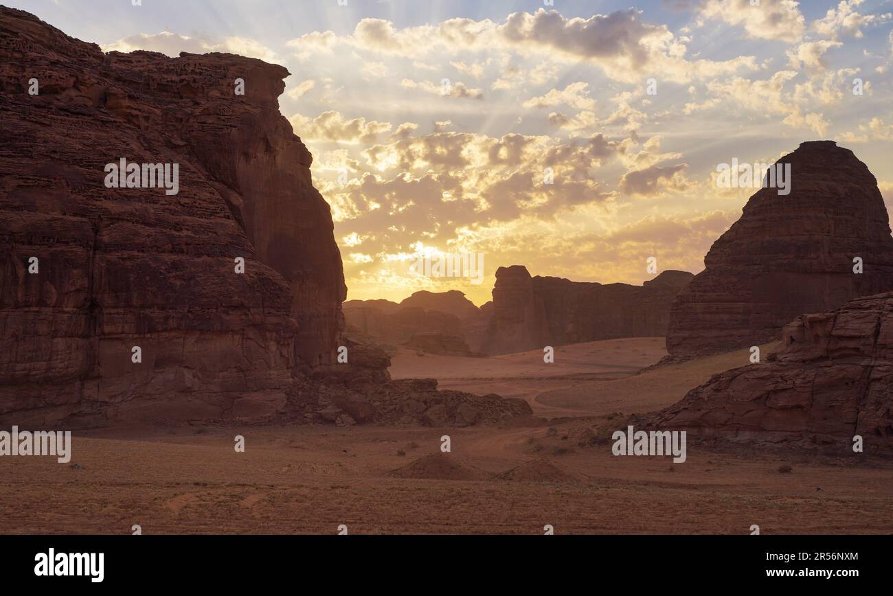 Morning sun shines over rocky desert formations, typical landscape in ...