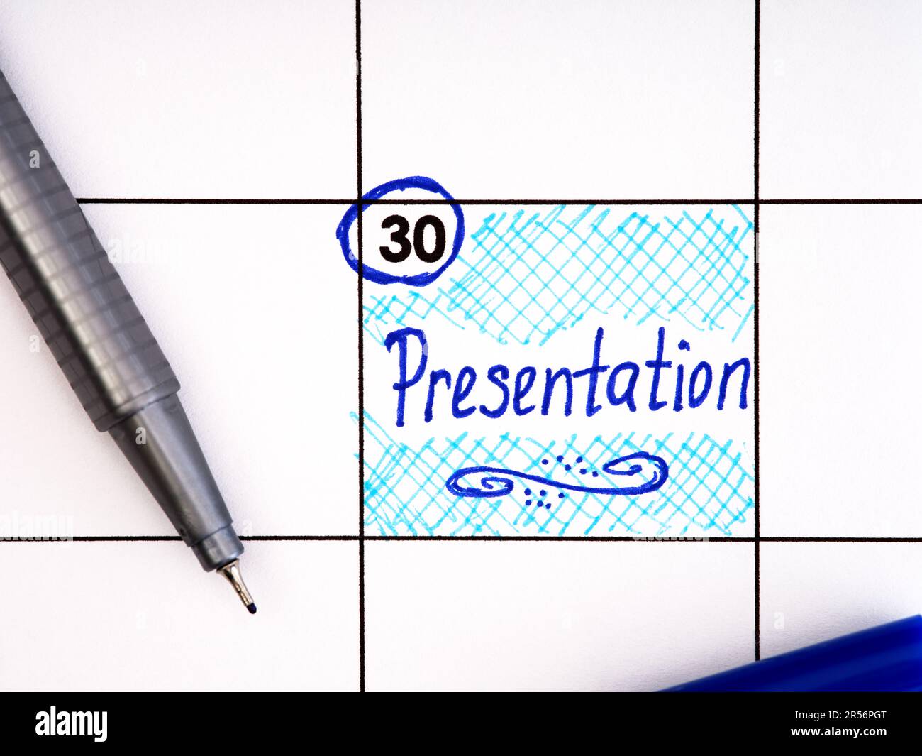 Handwritten reminder Presentation in the calendar with a blue pen ...