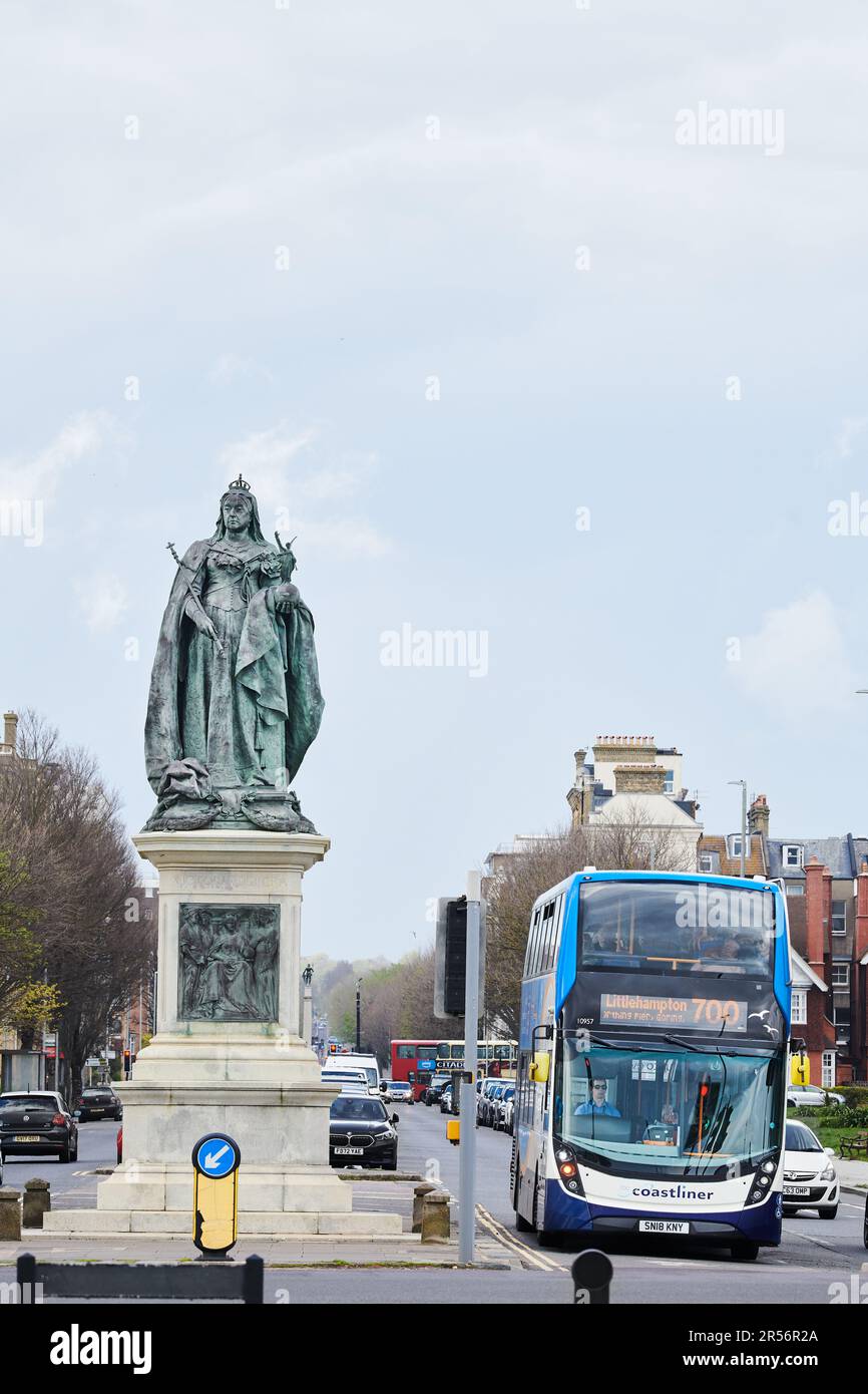 Number 700 double decker bus to Littlehampton, beside the statue of ...