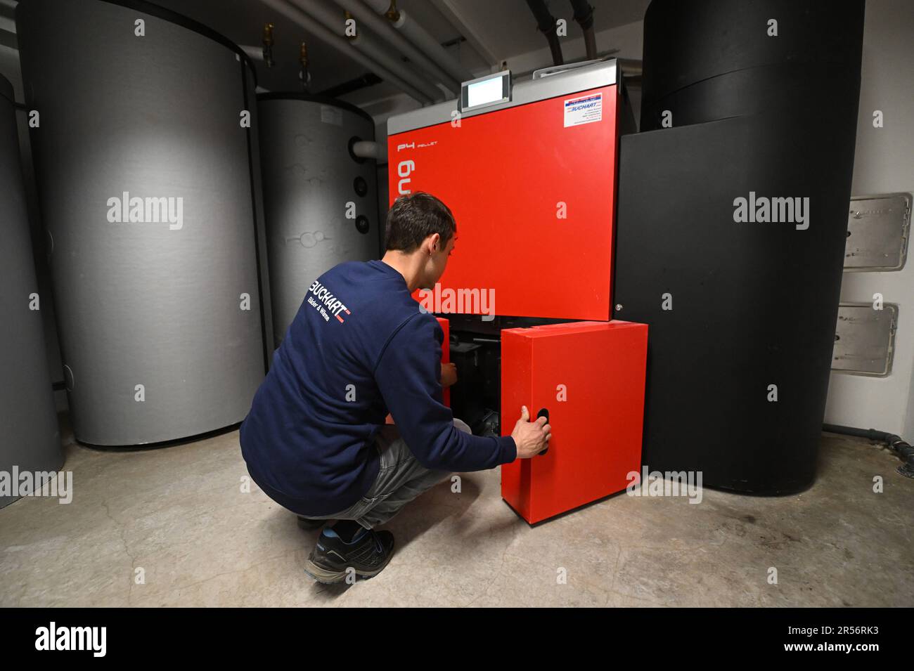 25 May 2023, Bavaria, Augsburg: A master heating engineer works on a ...