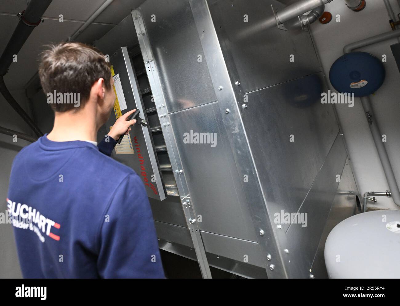 25 May 2023, Bavaria, Augsburg: A master heating engineer works on a ...