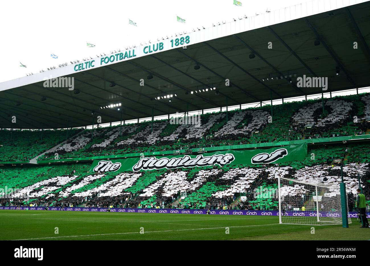 Celtic fans hold up banners to form text saying 'Stand Of Giants' before the cinch Premiership ...