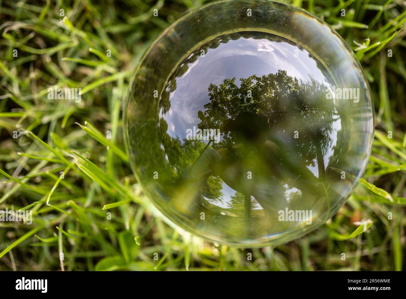 The landscape is turned upside down in the glass ball Stock Photo - Alamy