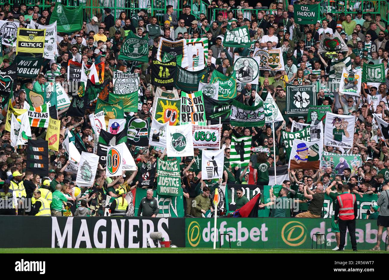 Celtic fans hold up banners and flags during the cinch Premiership ...