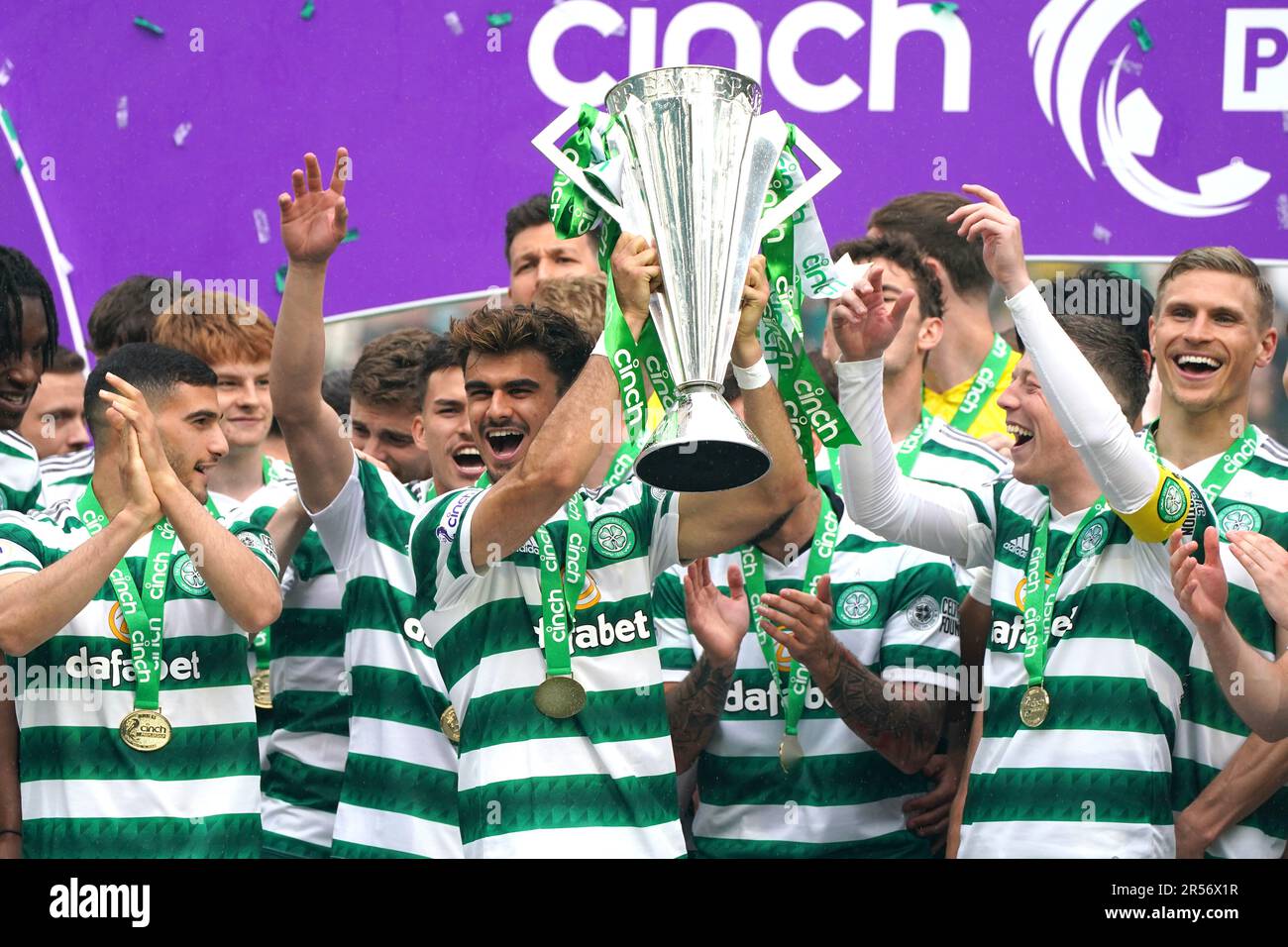 Celtic's Jota lifts the trophy after winning the cinch Premiership ...