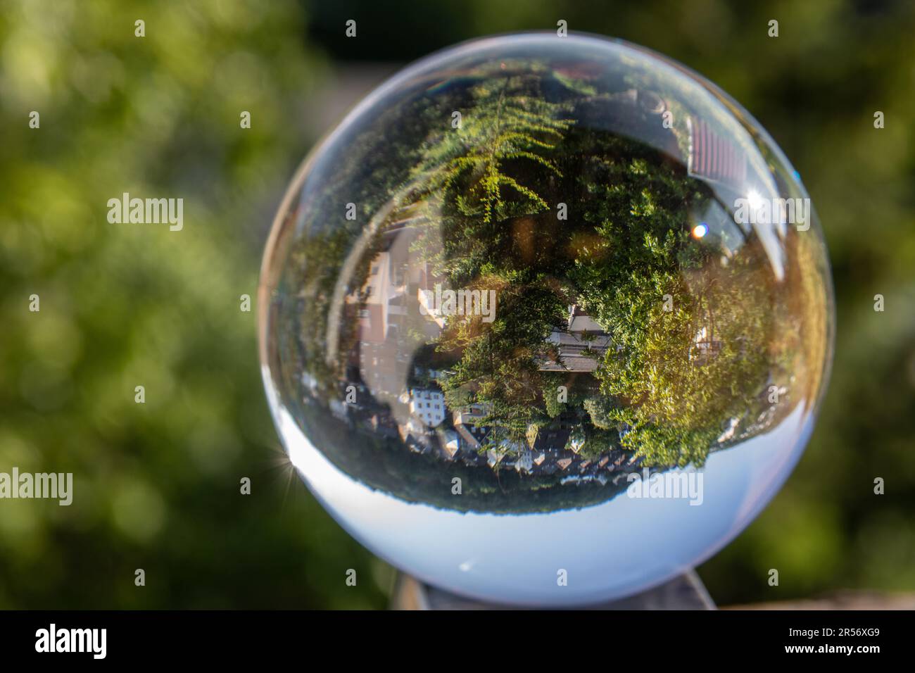The landscape is turned upside down in the glass ball Stock Photo - Alamy