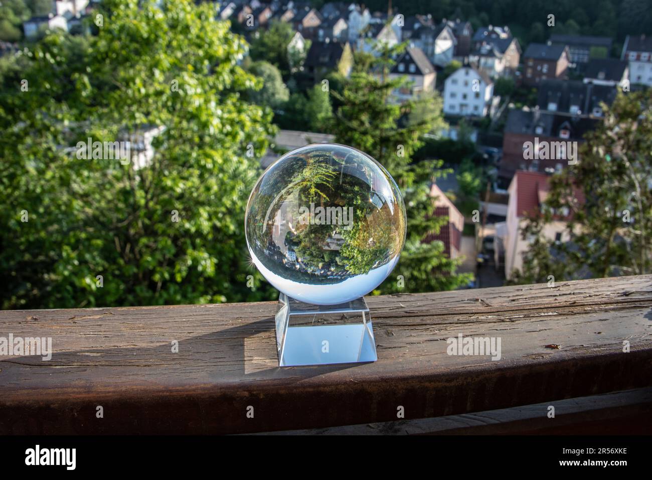 The landscape is turned upside down in the glass ball Stock Photo - Alamy