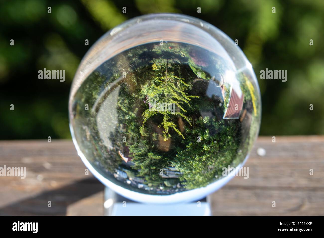 The landscape is turned upside down in the glass ball Stock Photo - Alamy