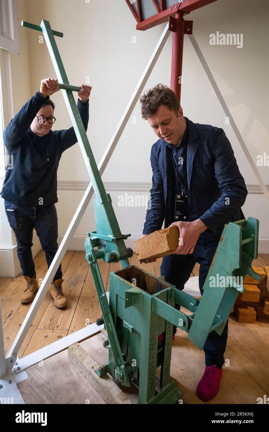 London, UK. 1 June 2023. Architects from Hassell with a Kenyan brick ...