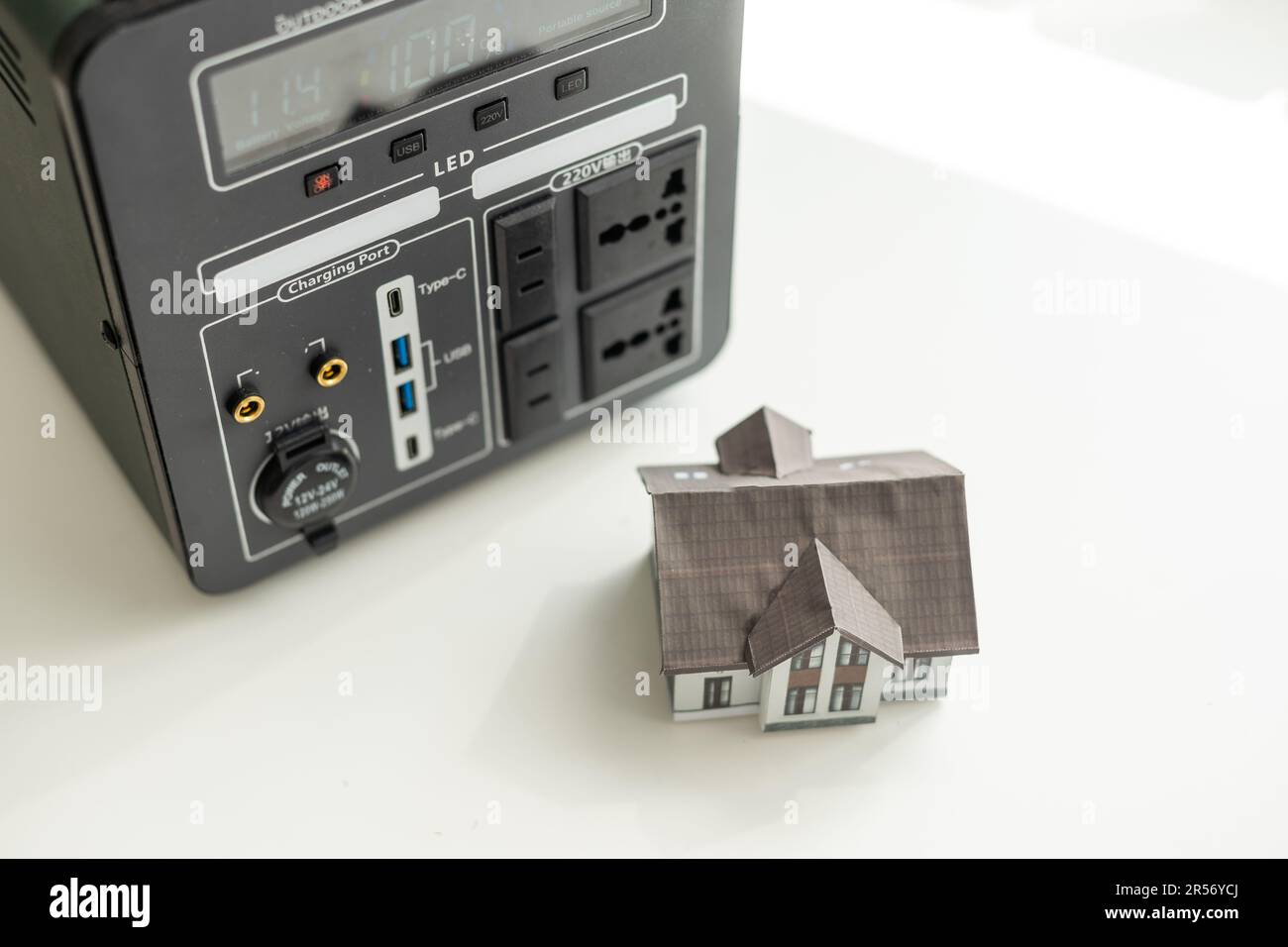 Portable power station charging devices on floor in living room Stock ...