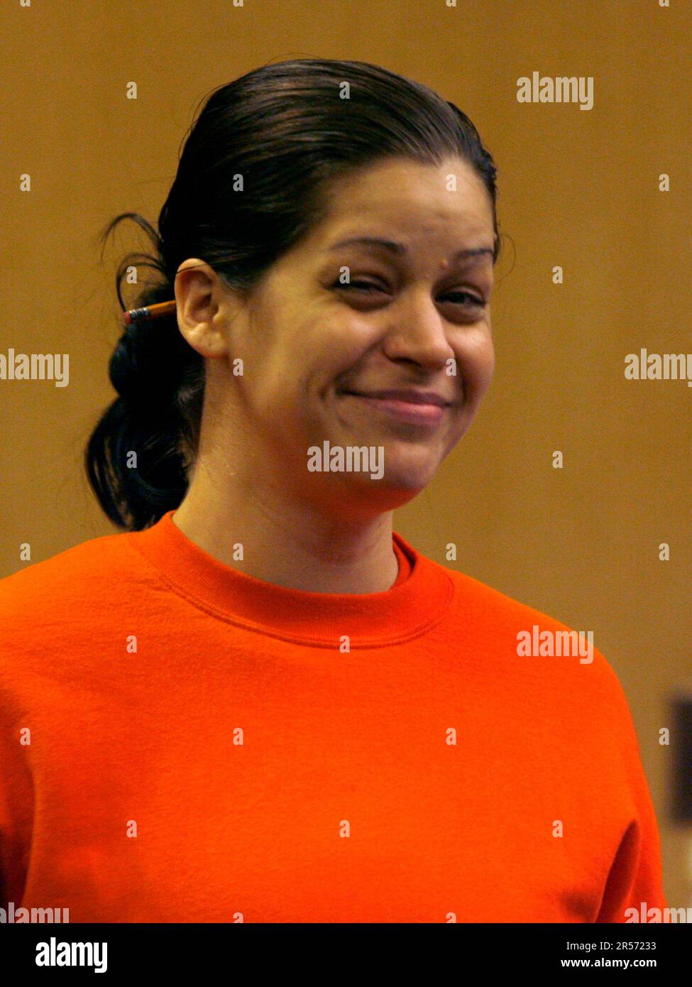 Maria Nelson smiles as she enters the courtroom before she was ...