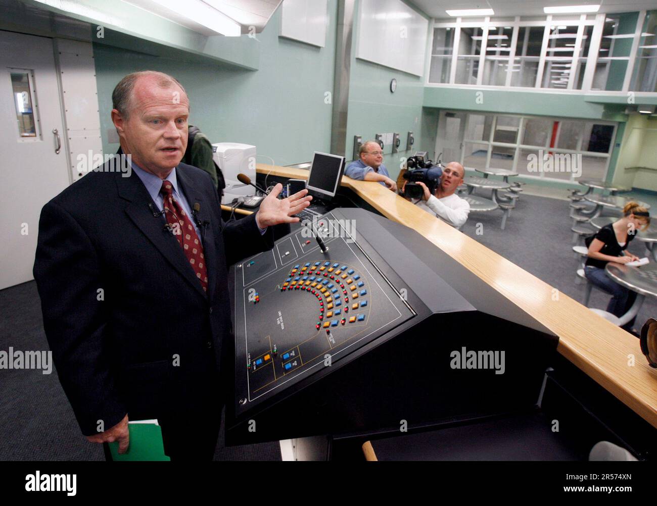 Sheriff Michael Hennessey demonstrates the control board at a guard's ...