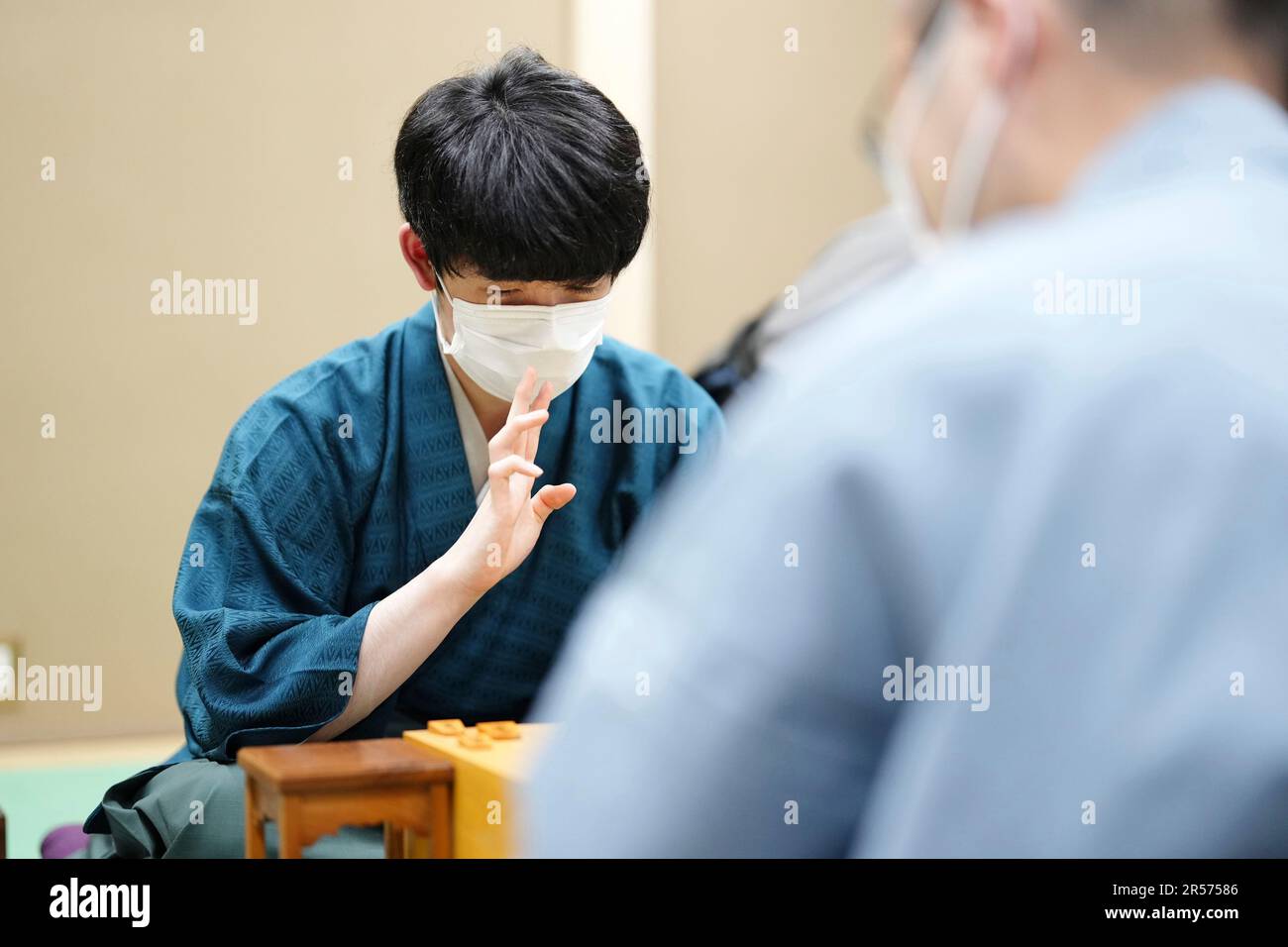 Shogi player Sota Fujii (L) reviews the Meijin title against Akira ...